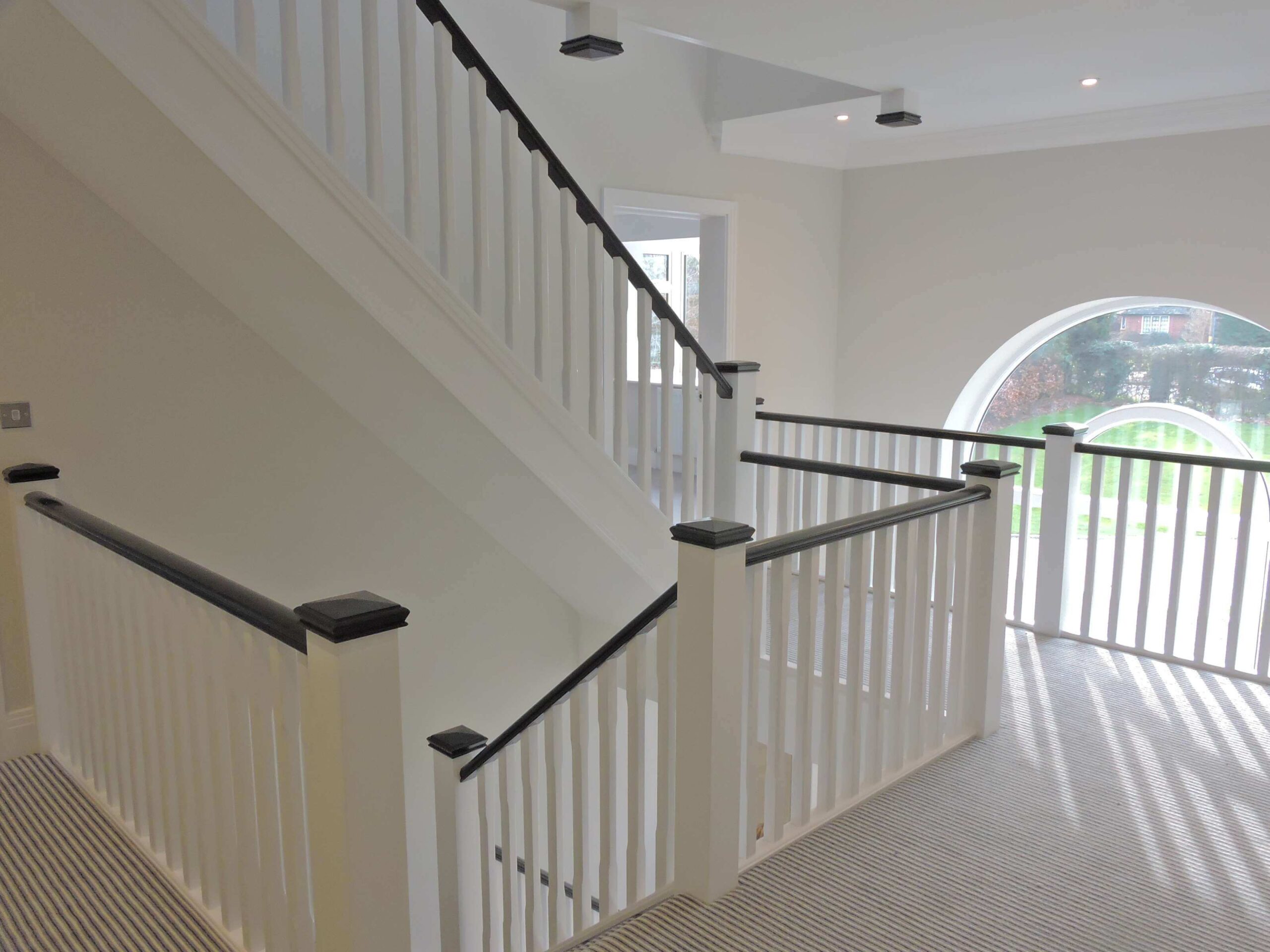 White Wooden Spindles with Dark Wood Rail Stairs | Roe Stairs